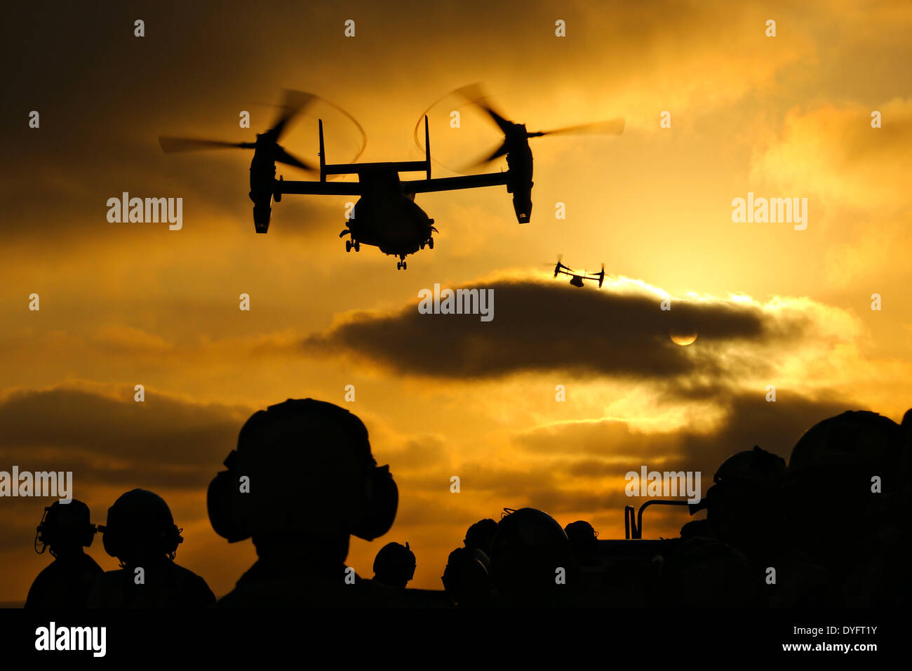 A US Marine Corps MV-22 Osprey aircraft take off from the flight deck ...
