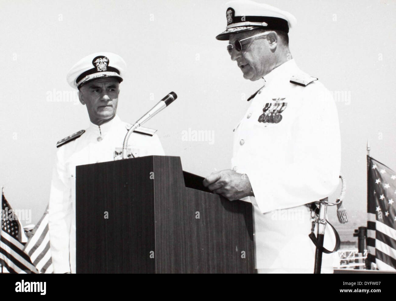 This image captures a change of command ceremony, featuring a speech by ...