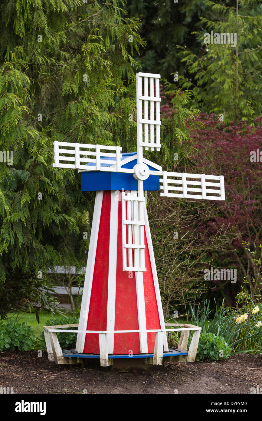 early spring garden decoration, small wooden wind mill with bright ...
