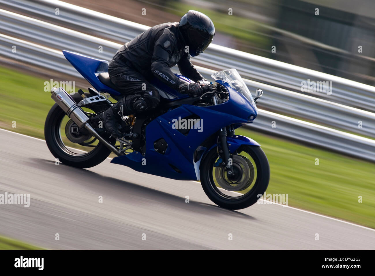 motorcycle speeding down the straight at oulton park race circuit Stock ...