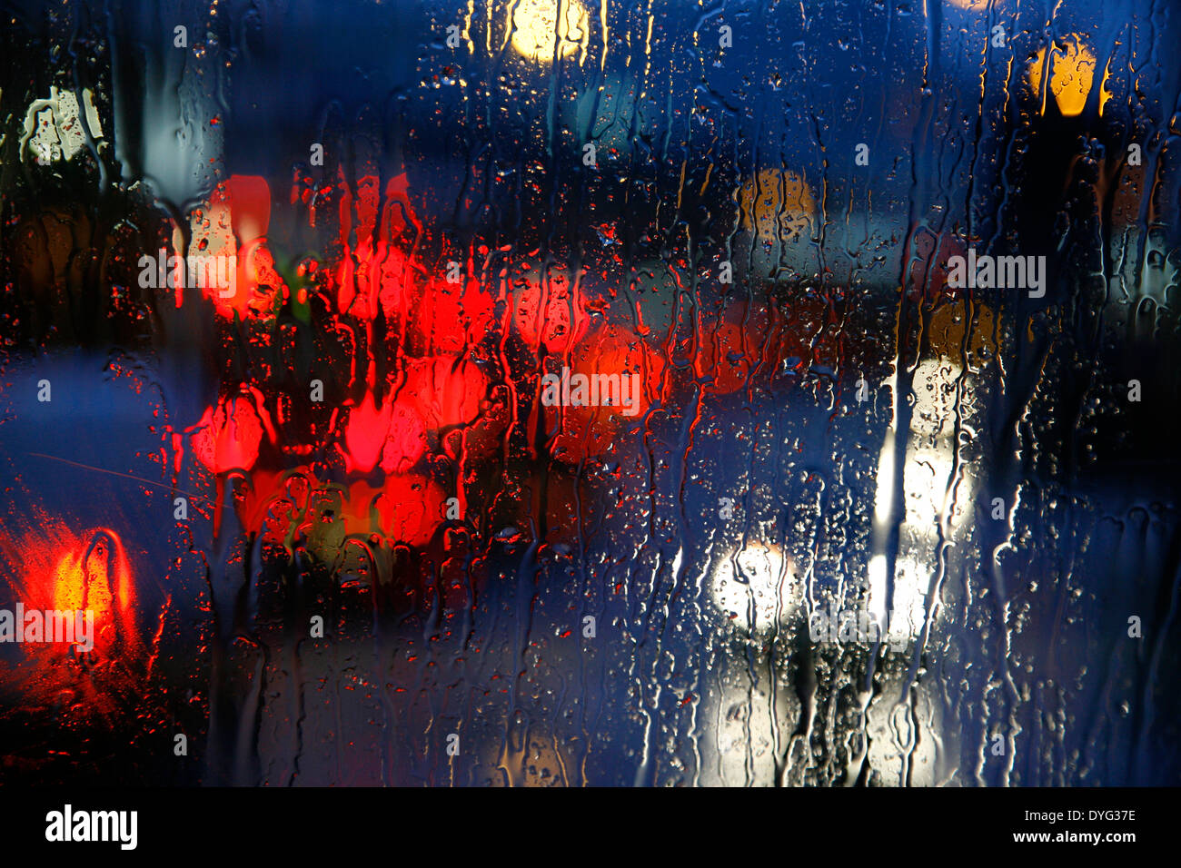 View through the rain-smudged window of the Number 14 bus to traffic on ...