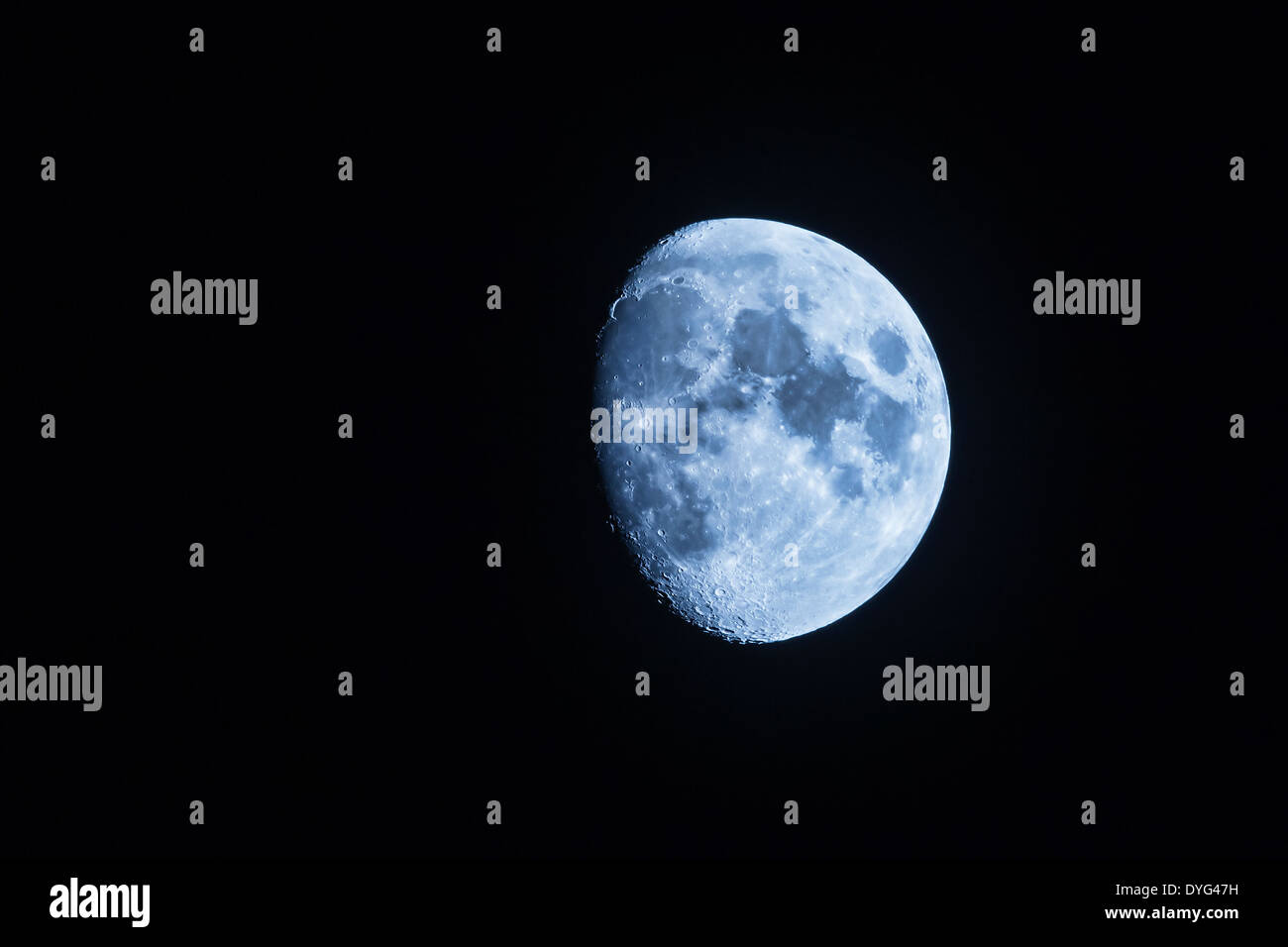 Three Quarter moon in the night sky over Northampton Stock Photo - Alamy