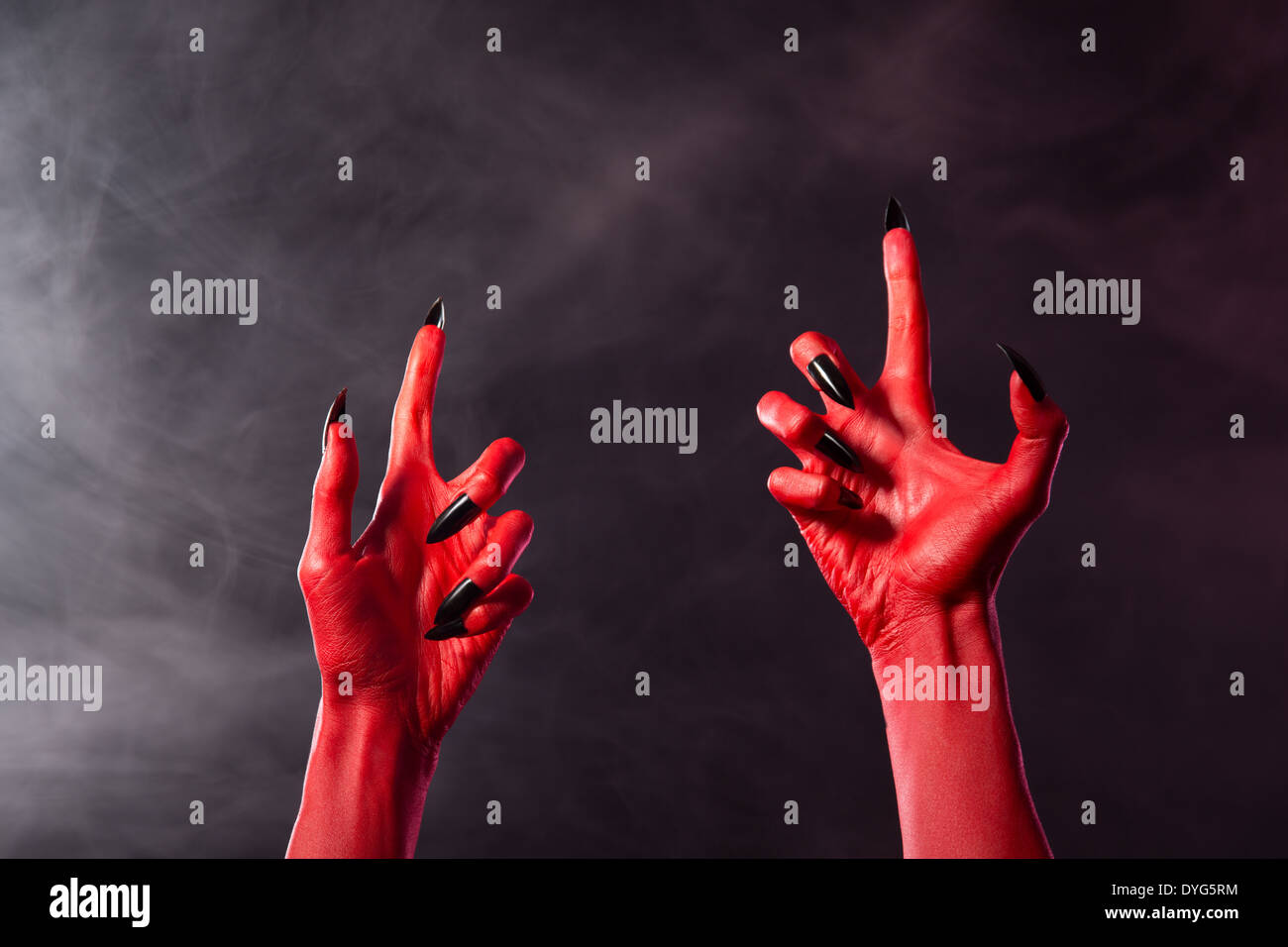 Creepy red devil hands with black sharp nails, Halloween theme Stock ...