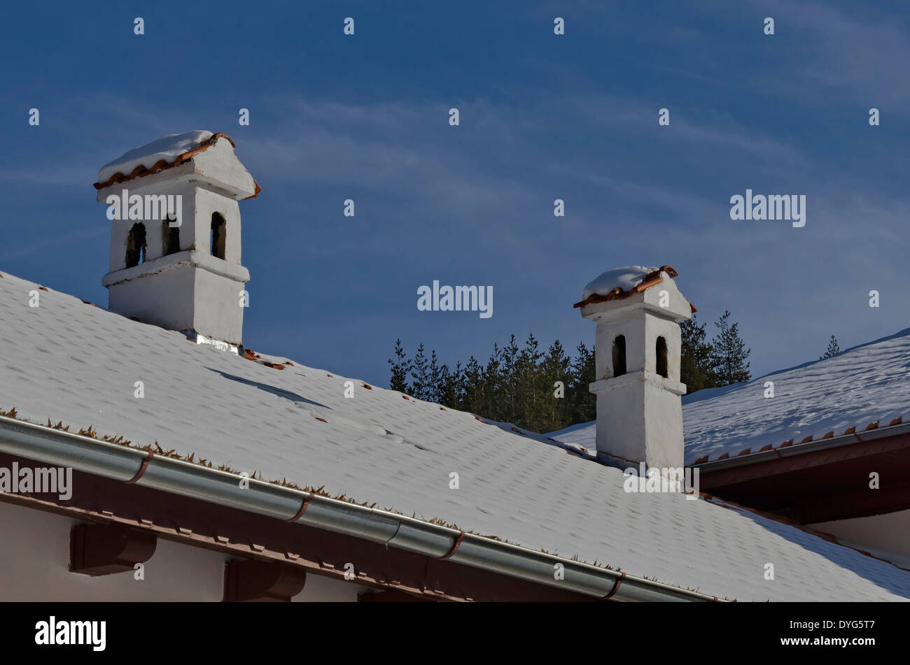 Roof with chimneys in winter Stock Photo - Alamy
