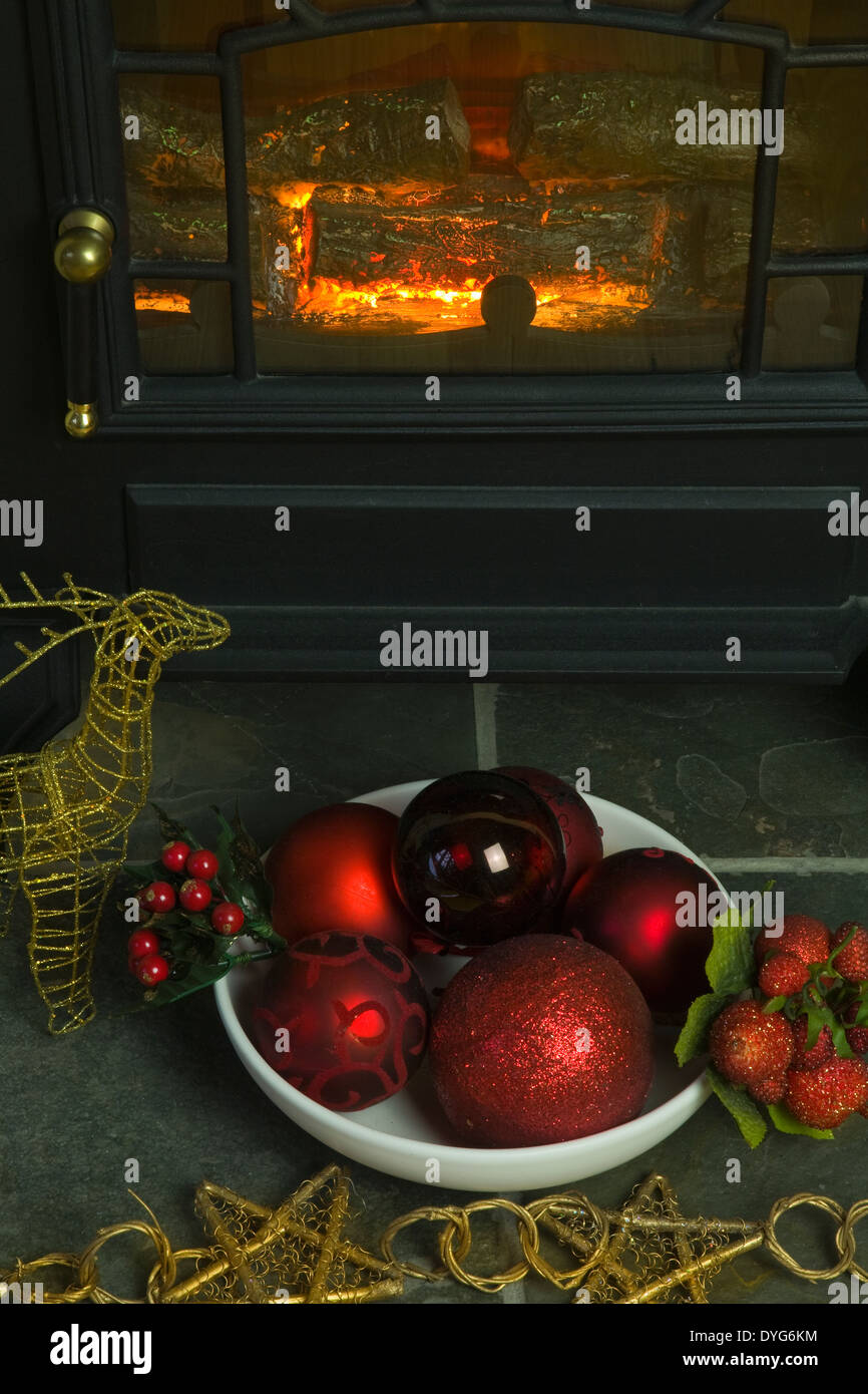 Christmas Decorations and Baubles in front of a home fire Stock Photo ...