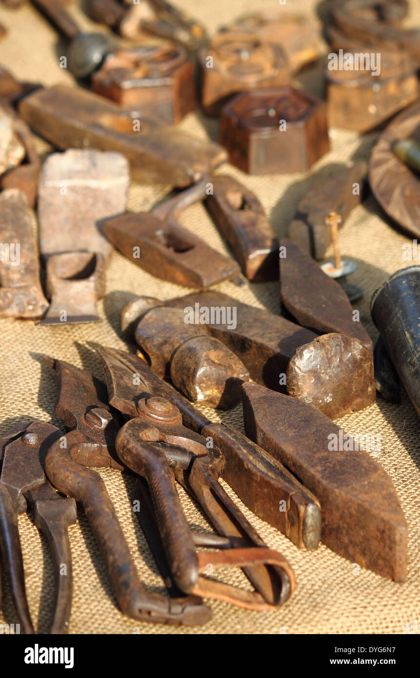 Tools of a blacksmith in a workbench Stock Photo - Alamy