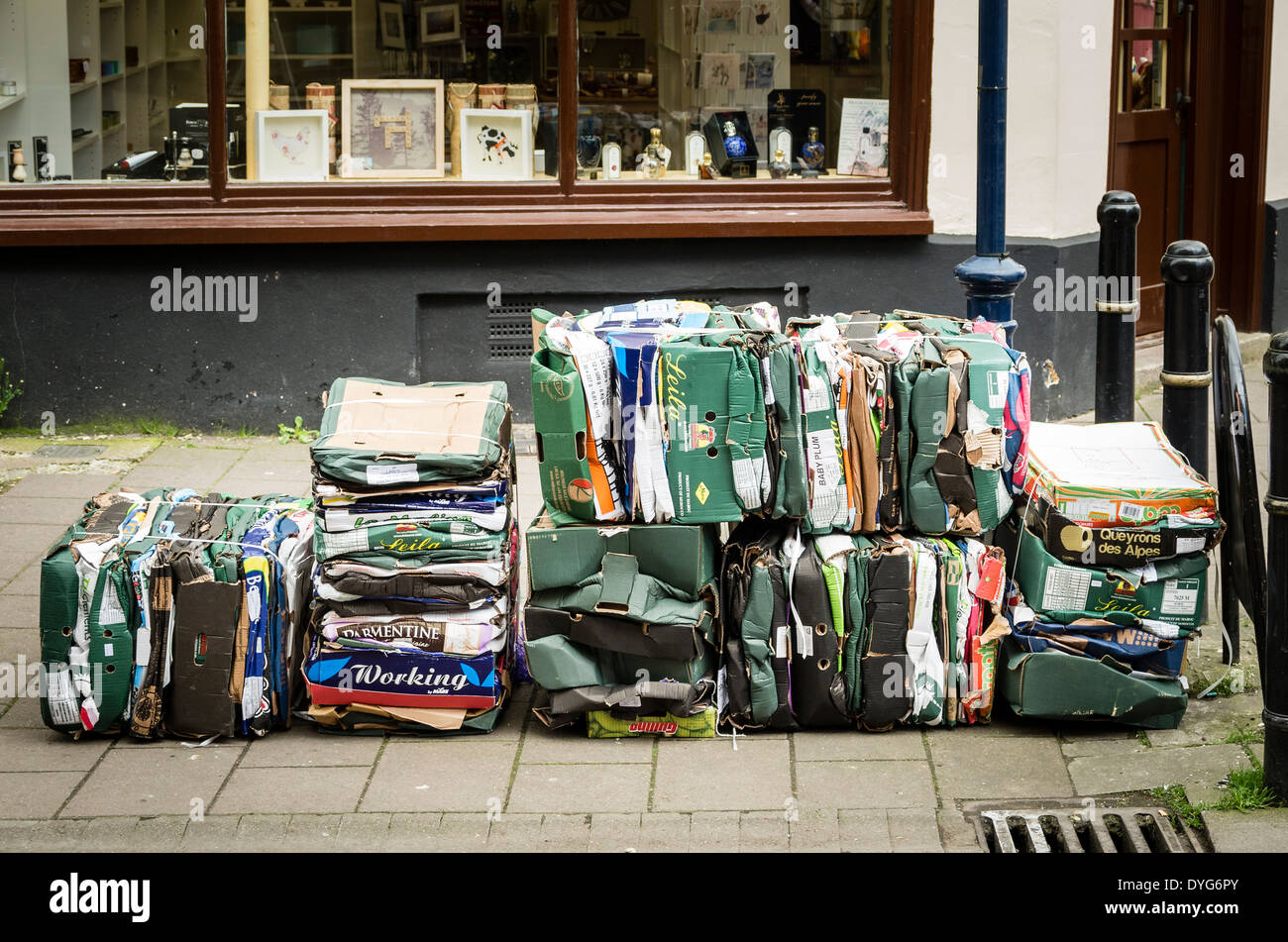 Neatly stacked used food carton stacked in an English street ready for ...