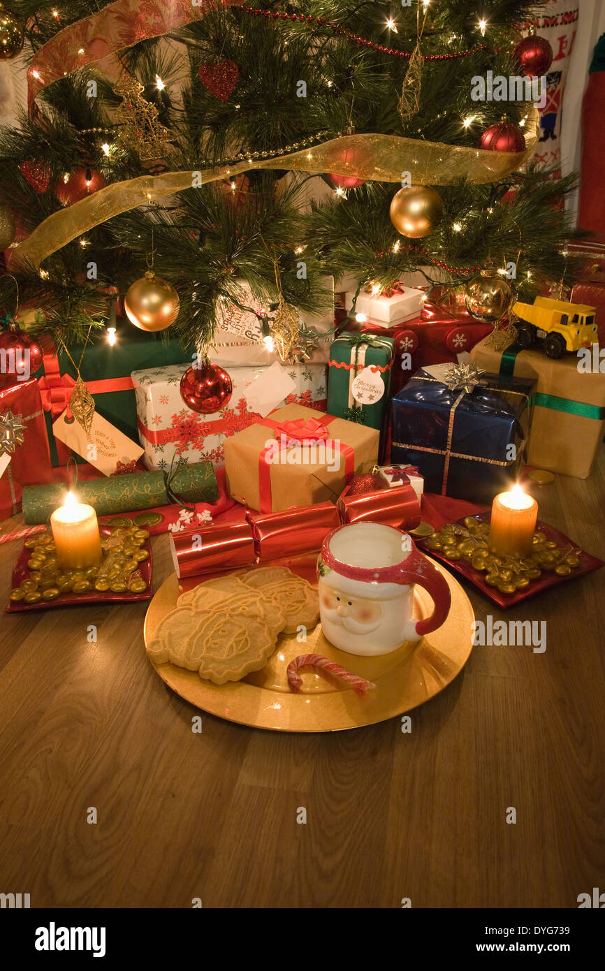 food for santa with Cookies and milk in a santa face shape mug Stock ...