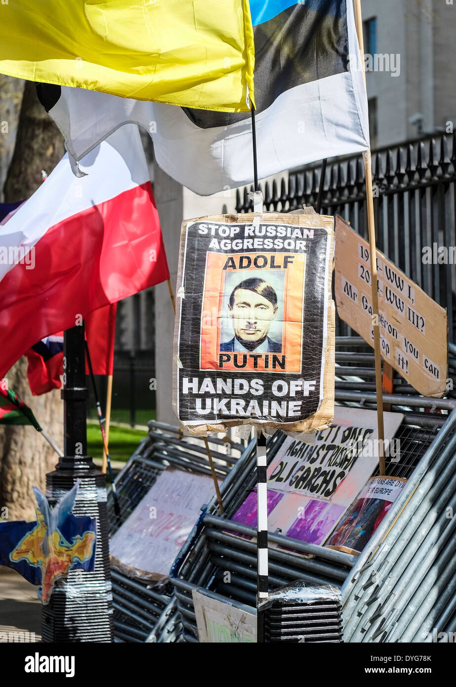 A satirical poster of Putin on display at a Ukrainian protest in London ...