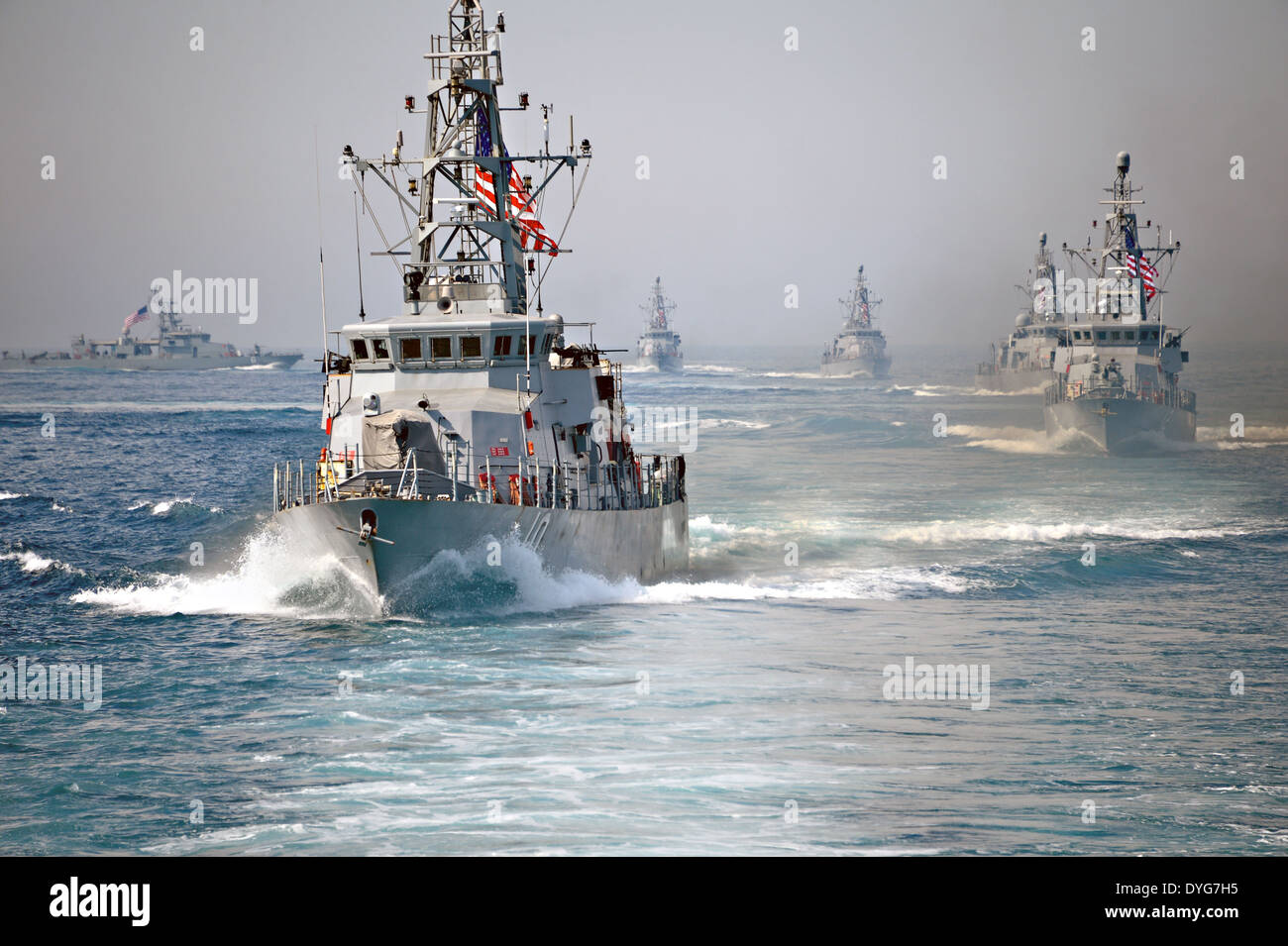 US Navy coastal patrol ship the USS Firebolt leads a formation of Stock ...