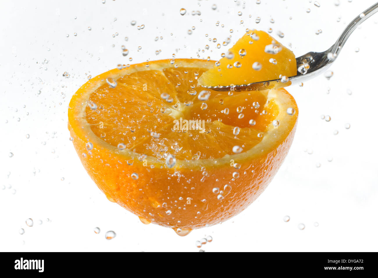Orange and water splash Stock Photo - Alamy