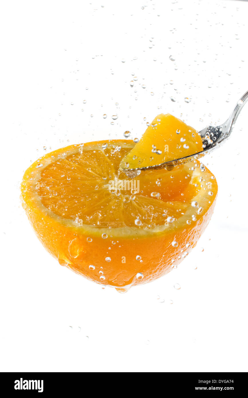 Orange and water splash Stock Photo - Alamy