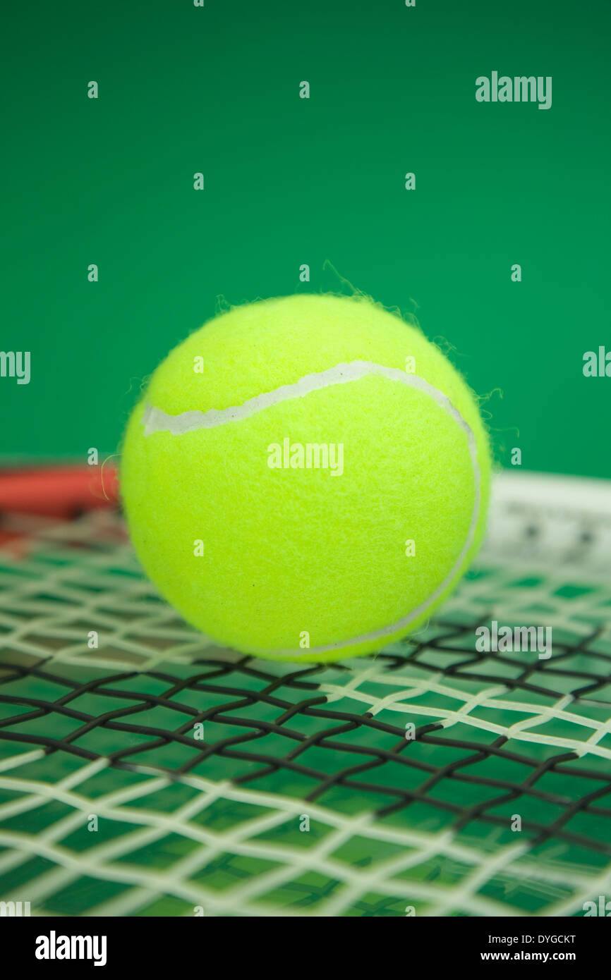 Tennis ball on a Carbon Graphite tennis racket Stock Photo - Alamy