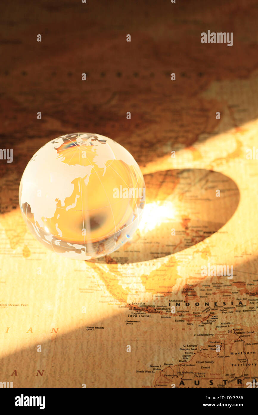 Glass globe on map Stock Photo - Alamy