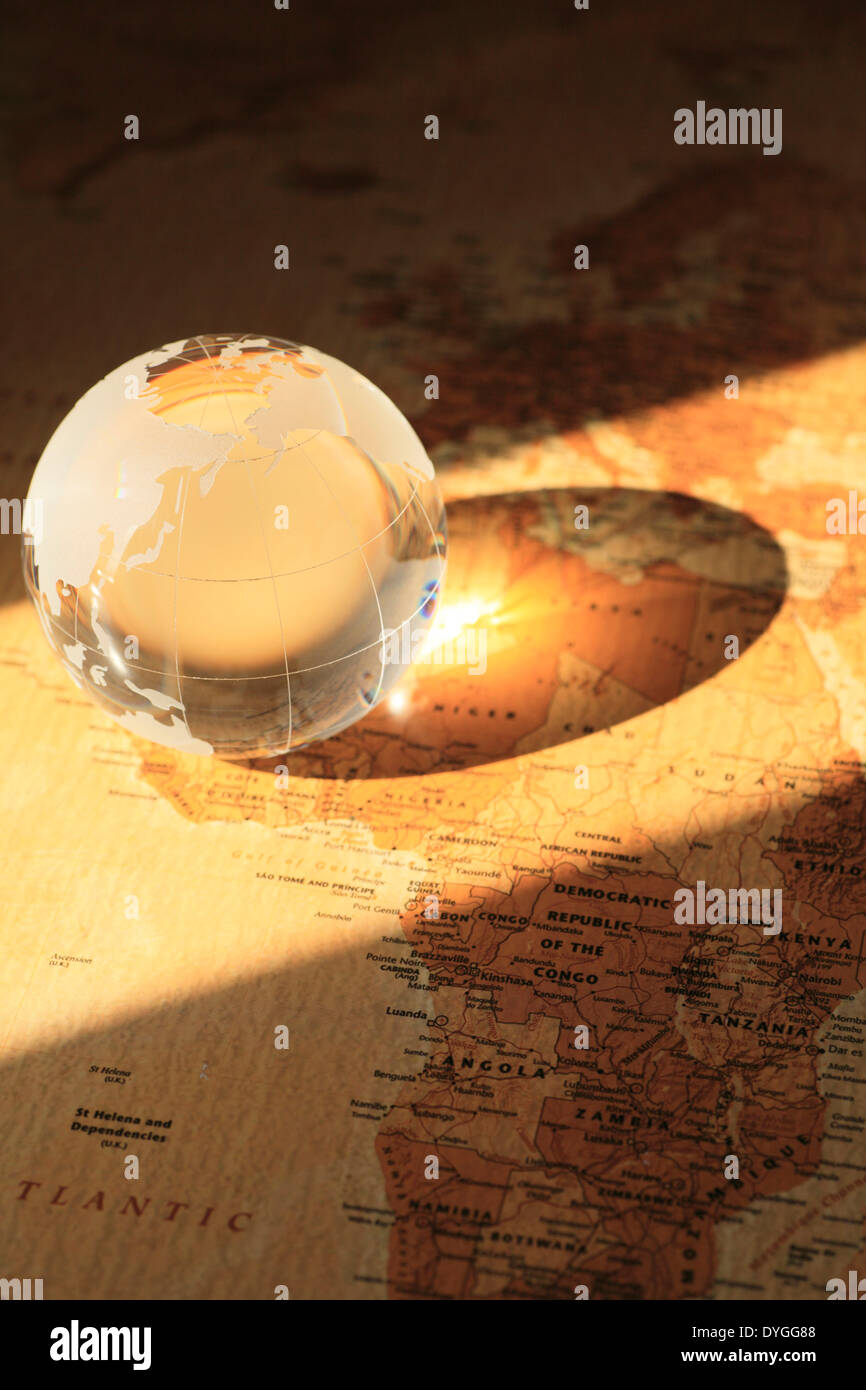Glass globe on map Stock Photo - Alamy
