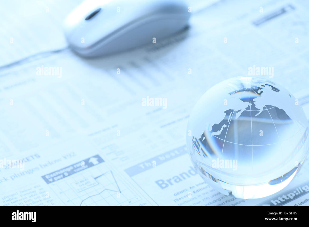 Glass globe and newspaper Stock Photo - Alamy