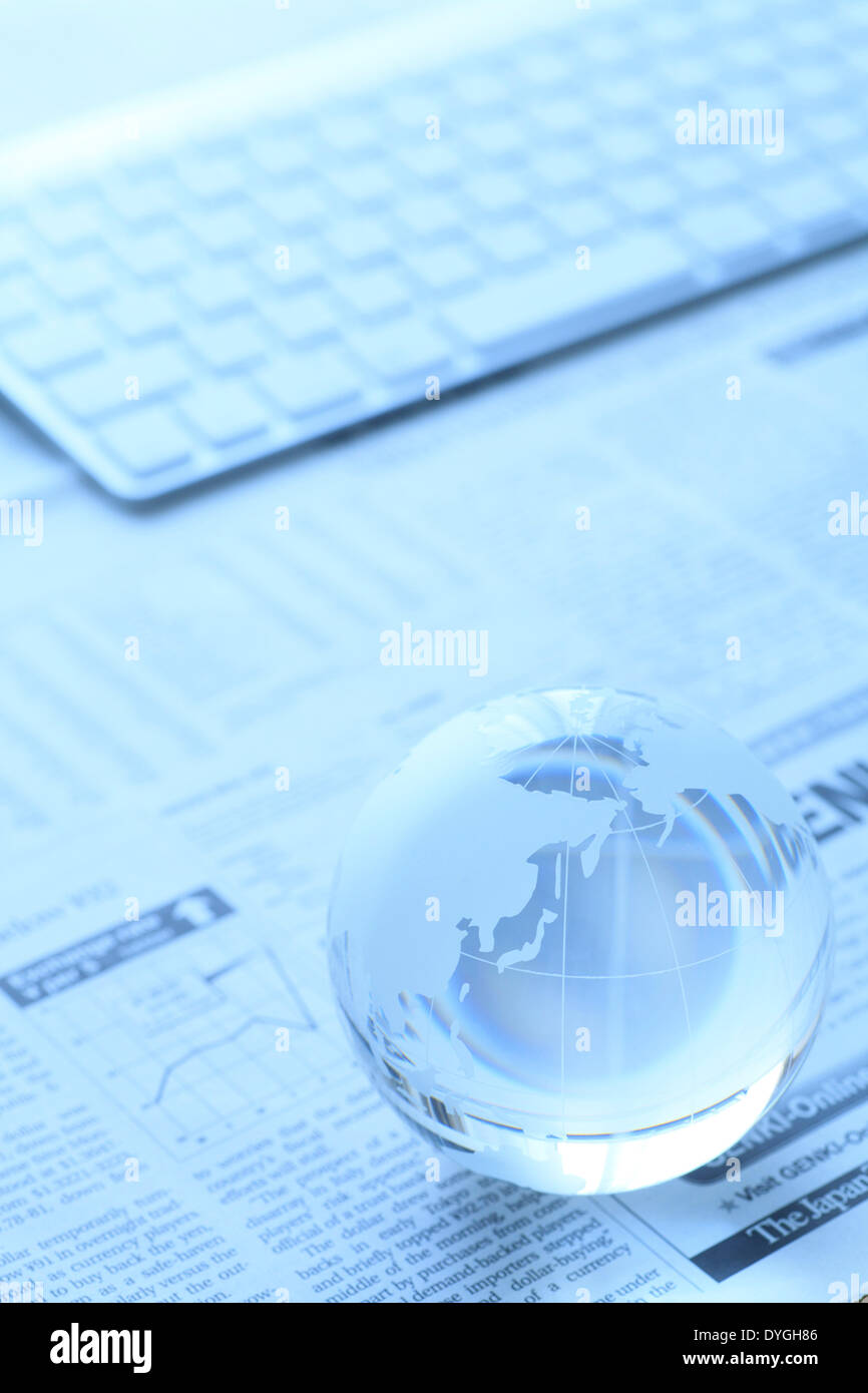 Glass globe and computer Stock Photo - Alamy