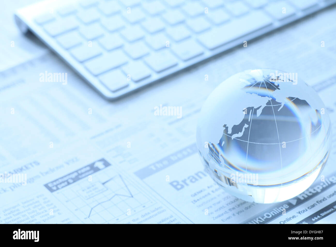 Glass globe and computer Stock Photo - Alamy