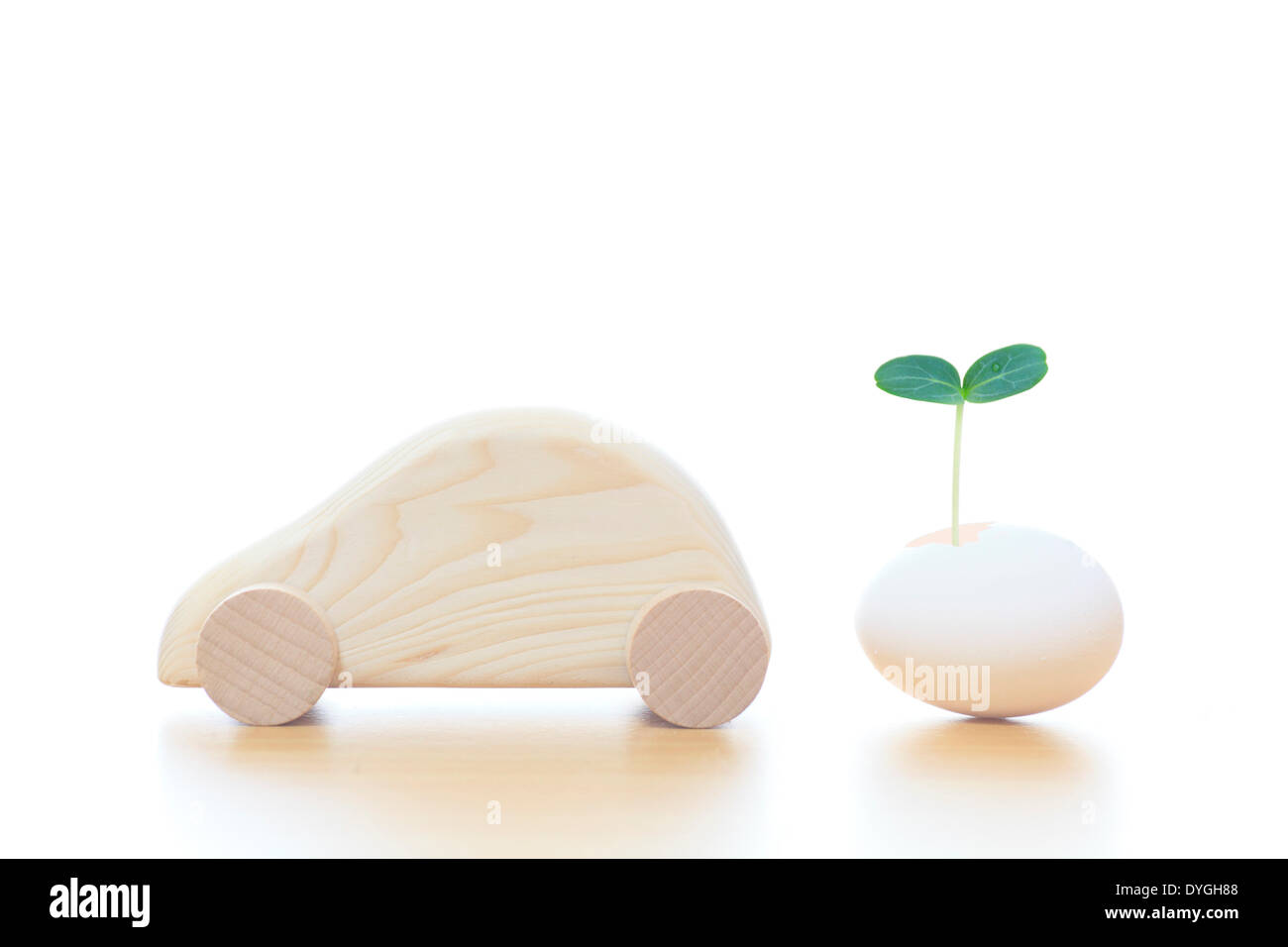 Wooden car and leaf sprouting from egg Stock Photo - Alamy