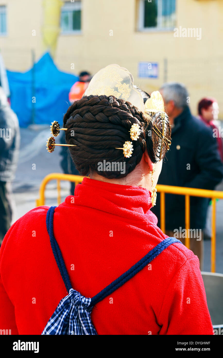 Spanish girl with traditional fiesta hair style, San Blas festival in ...
