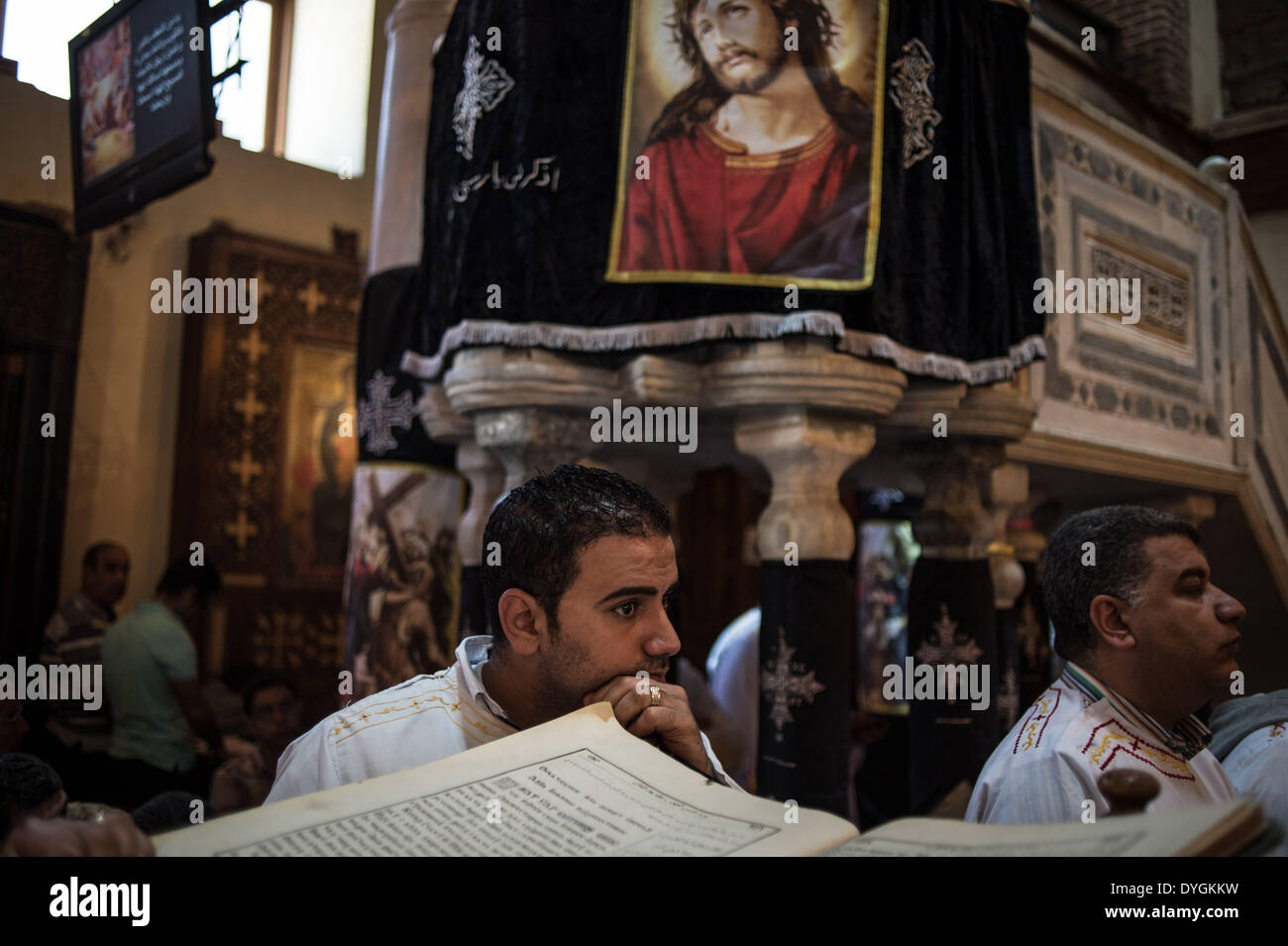 Cairo, Egypt. 17th Apr, 2014. An Egyptian Coptic man attends a mass on ...