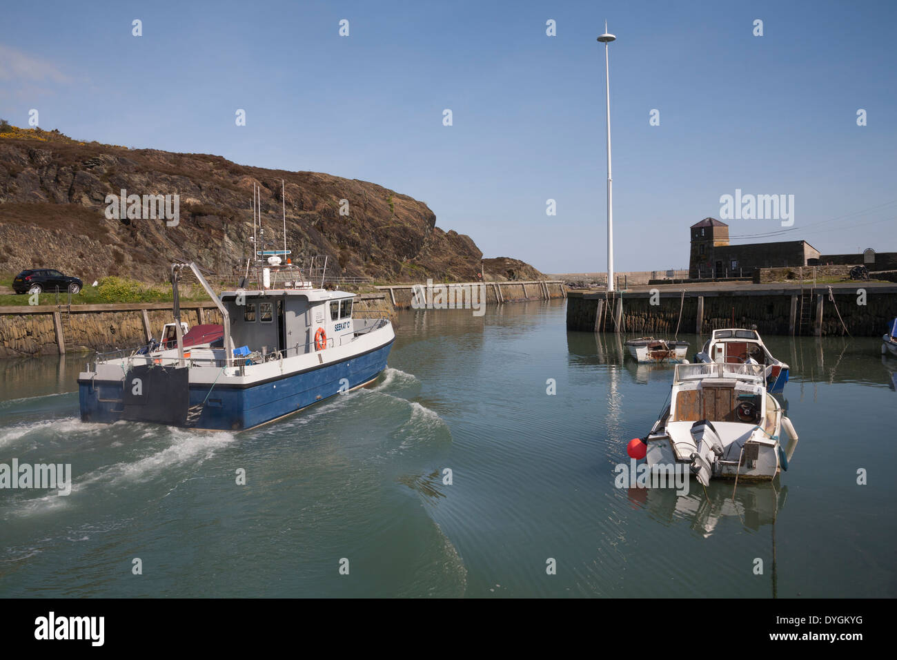 Fishing boat leaving harbour on fishing trip Amlwch Port isle of ...
