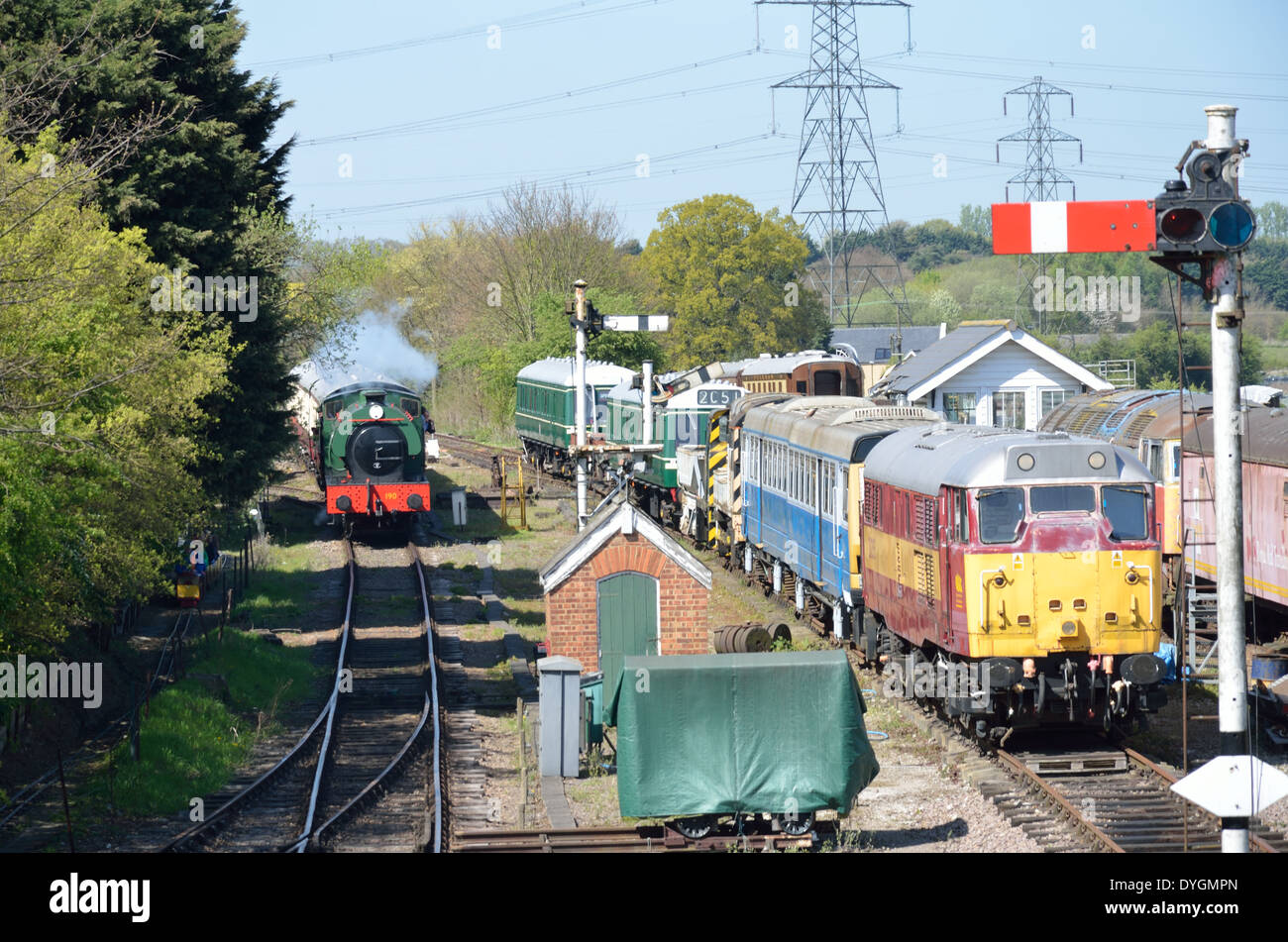 Steam train coming into station Stock Photo - Alamy