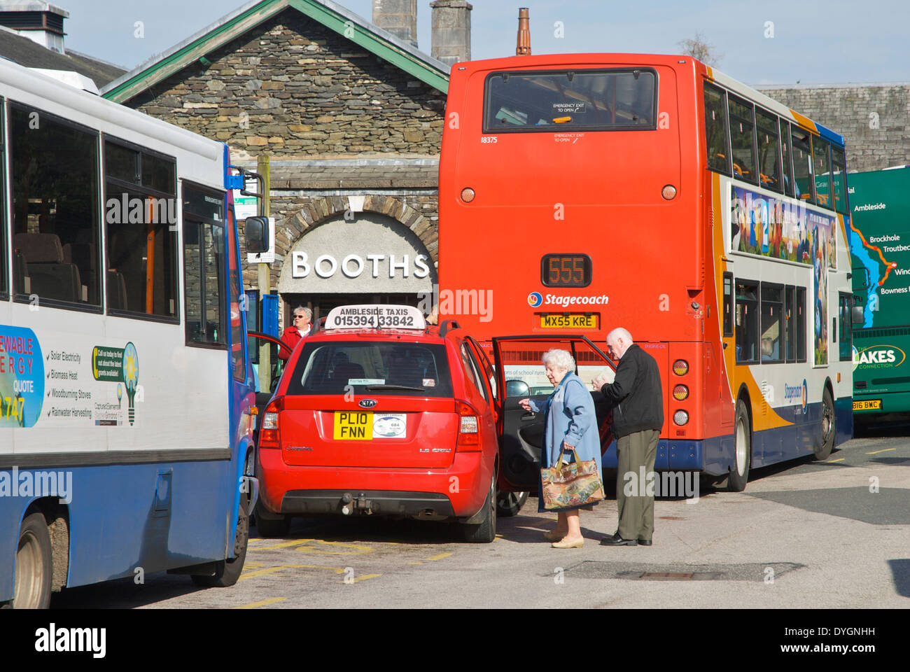 Buses and taxi outside Booths supermarket, Windermere, Lake District ...