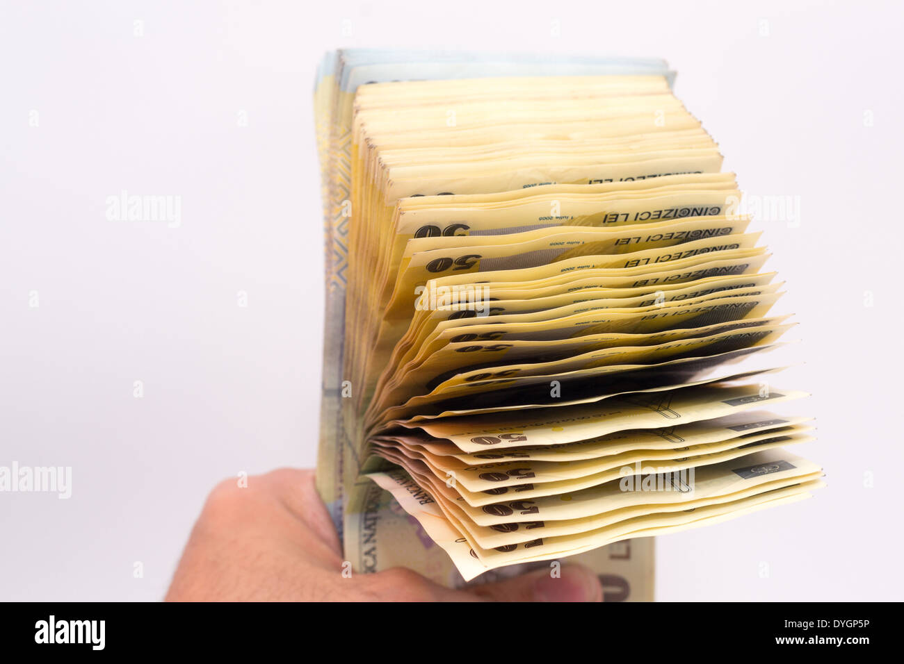 Stack of Romanian Lei held in the hand Stock Photo - Alamy