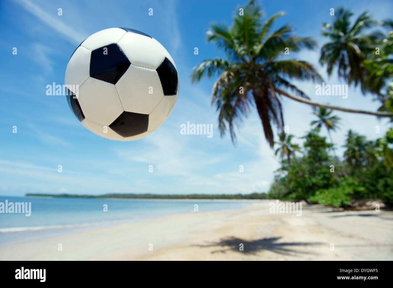 Soccer ball football flying in the sky over tropical bright Brazilian ...