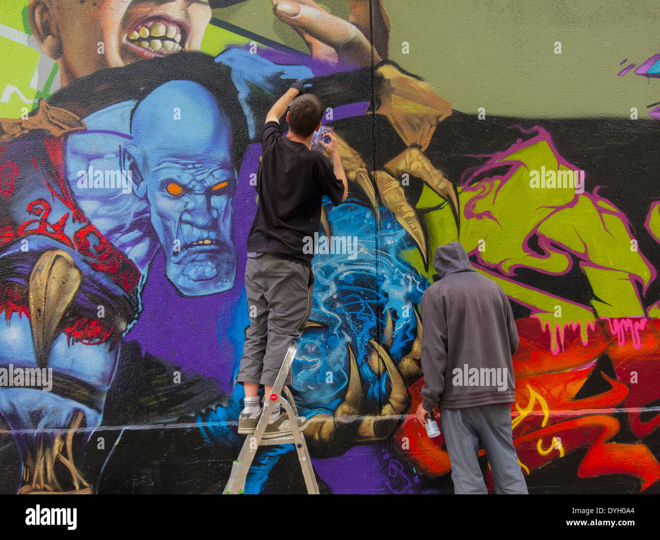 Paris, France, Young French Graffiti Artist Painting Wall Stock Photo ...