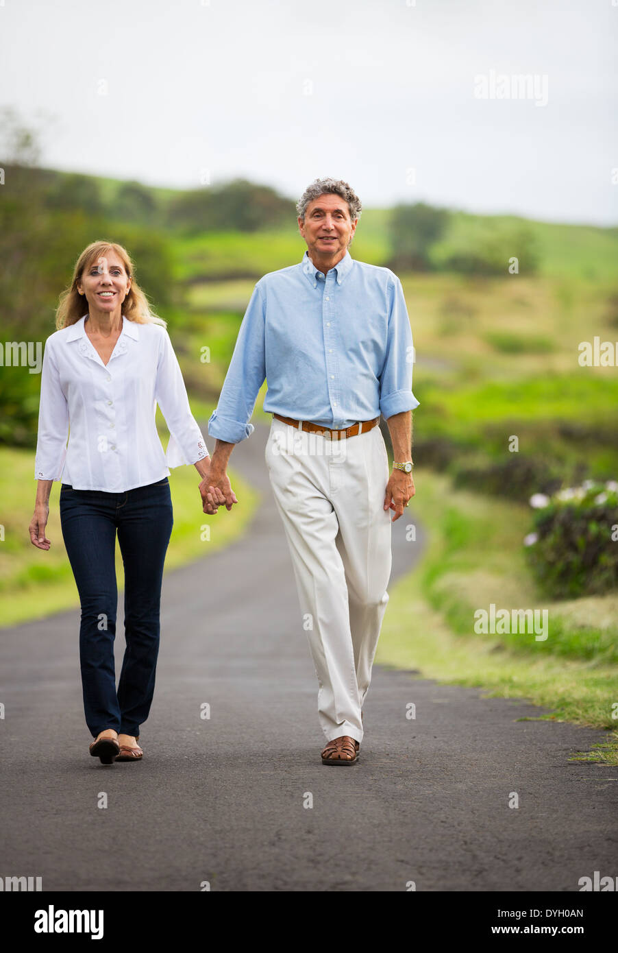 Mature middle age couple in love walking in countryside Stock Photo - Alamy