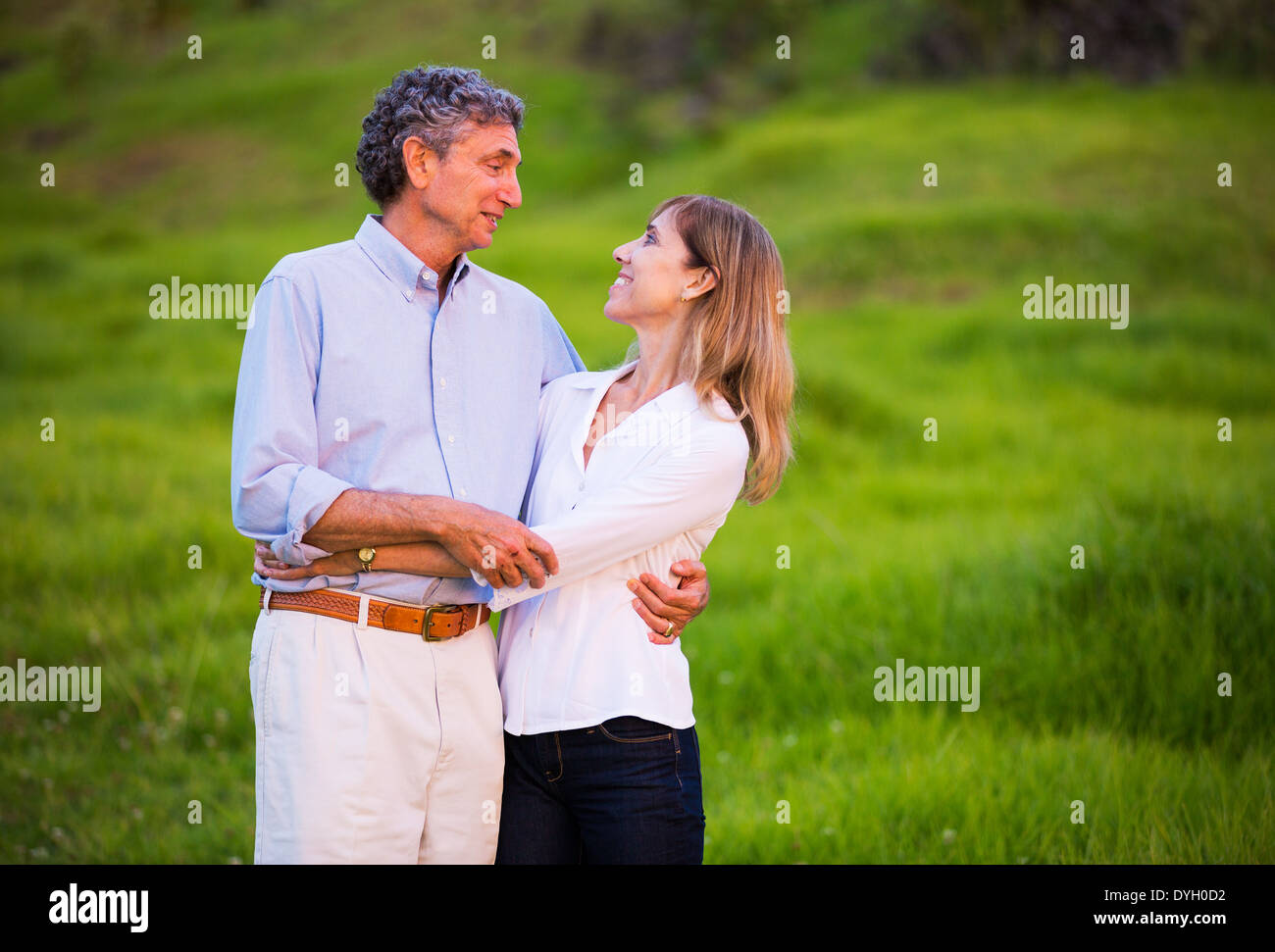 Mature middle age couple in love hugging and embracing Stock Photo - Alamy