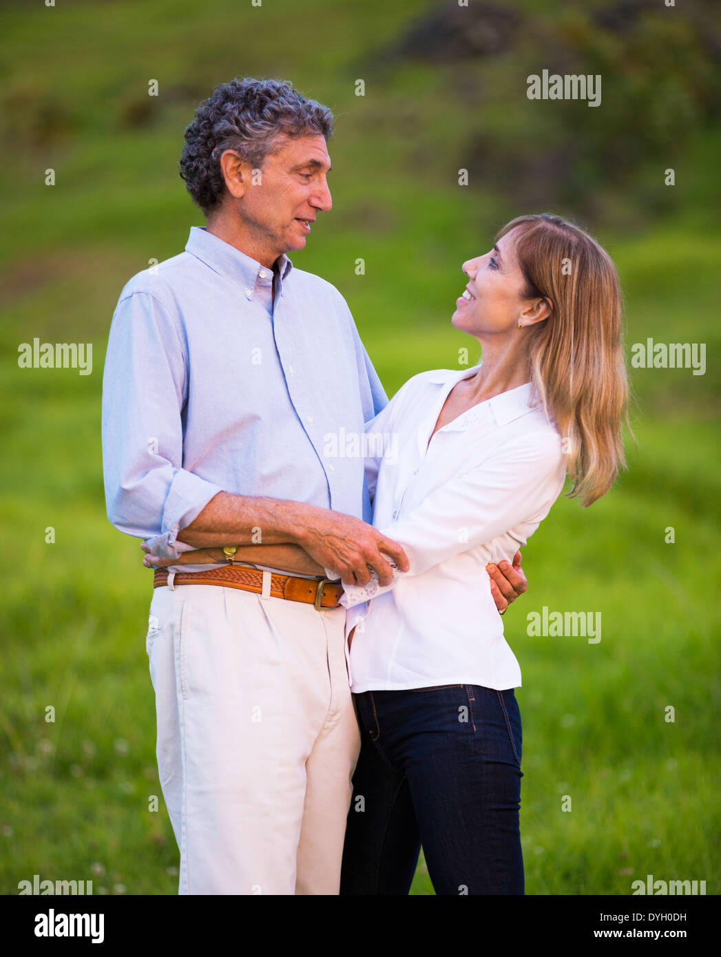 Mature middle age couple in love hugging and embracing Stock Photo - Alamy