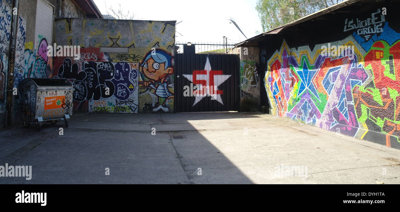 Blue sky view courtyard between buildings with cartoon image and ...