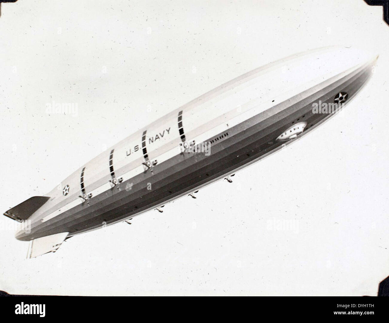 This image features a Goodyear airship, along with the USS Akron and ...