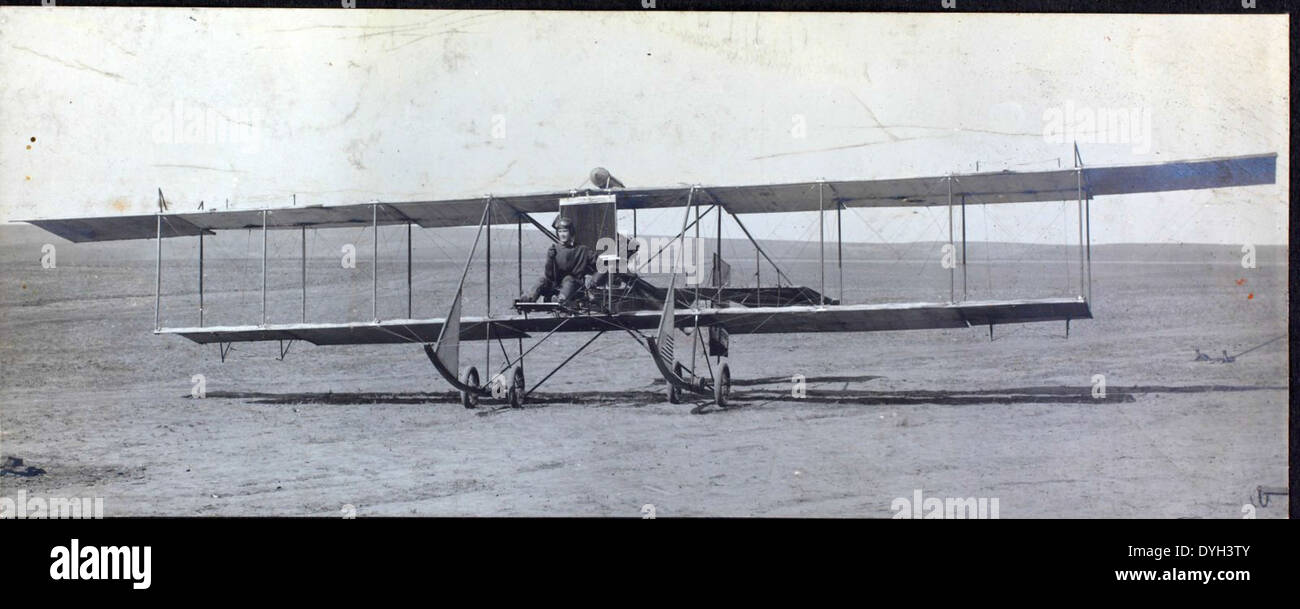 This historical photograph captures the barnstorming era of aviation ...