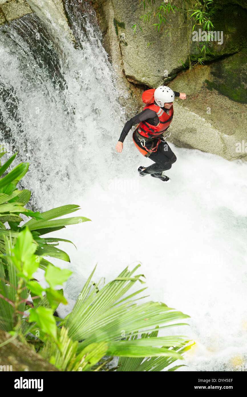 Woman jumping waterfall hi-res stock photography and images - Alamy