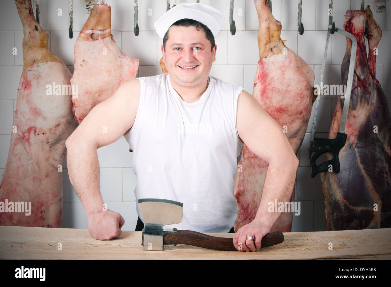 Muscular Butcher Portrait At His Workplace With A Large Ax Stock Photo ...