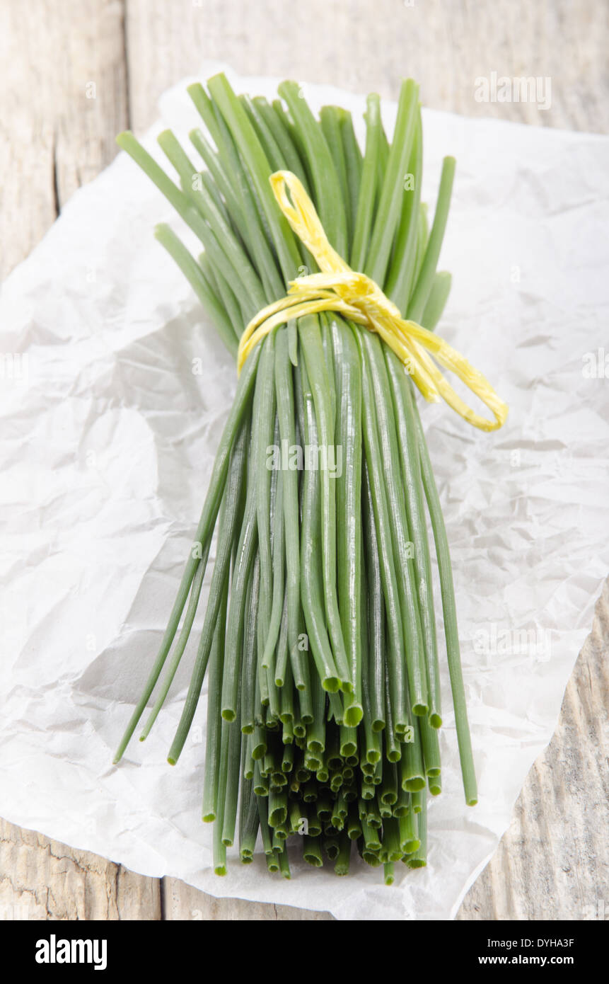 bunch chives with yellow ribbon on white kitchen paper Stock Photo - Alamy