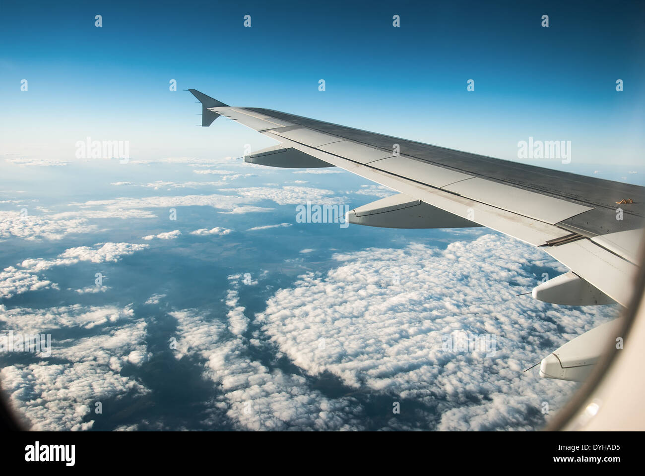 view from an airplane above the clouds Stock Photo - Alamy
