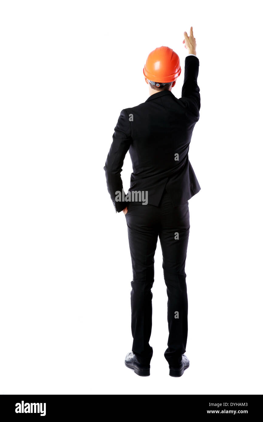 Back view portrait of a businessman in protective helmet directing ...