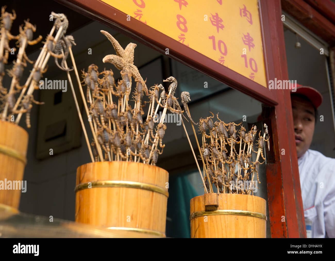 Beijing, China. 14th Apr, 2014. Scopriones on a stick are sold as food ...
