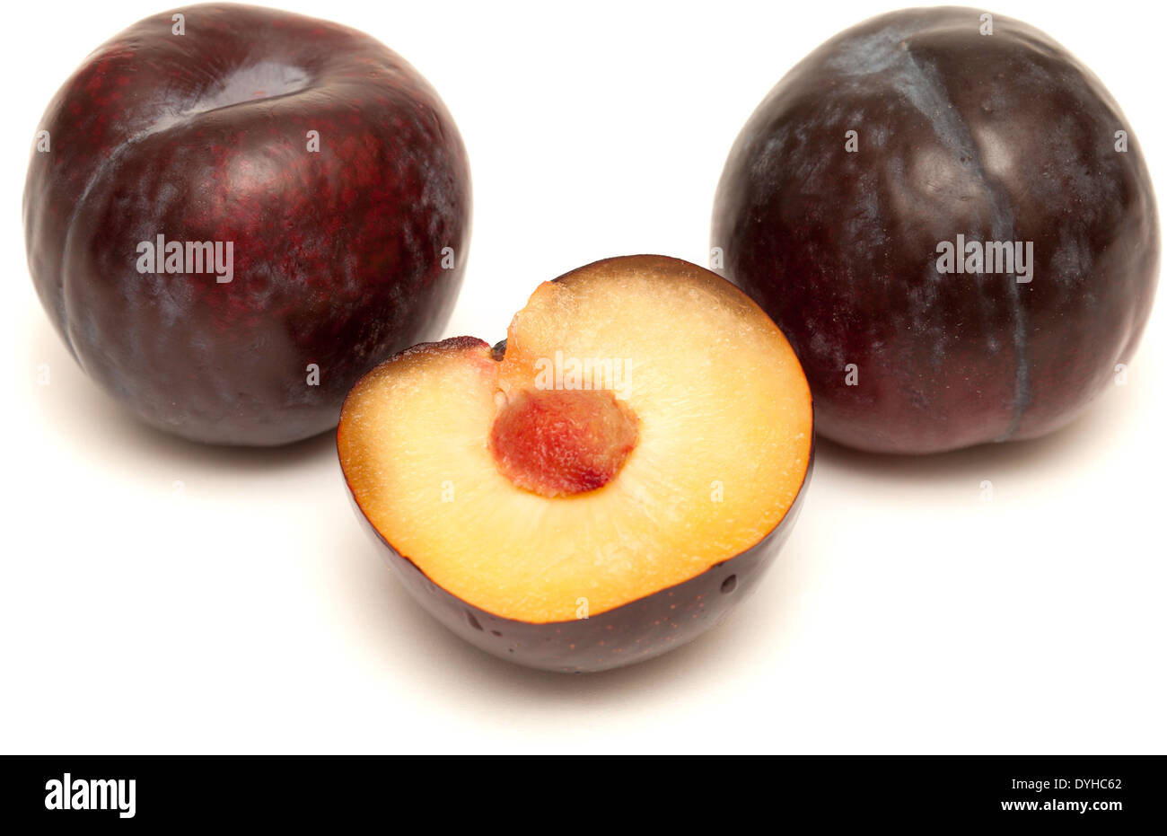 dark red plums isolated on white Stock Photo - Alamy