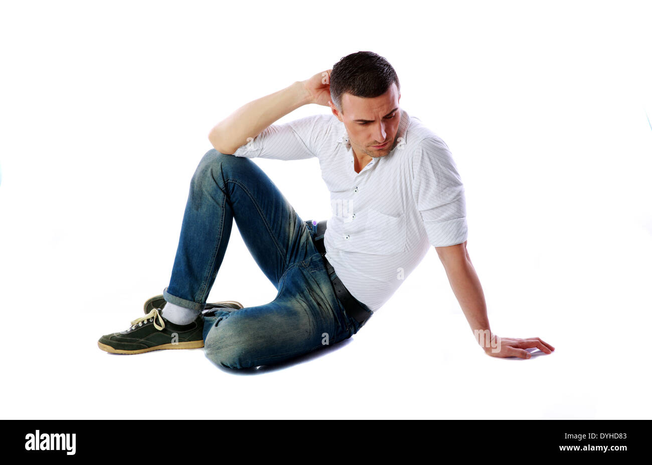 Handsome man sitting floor hi-res stock photography and images - Alamy