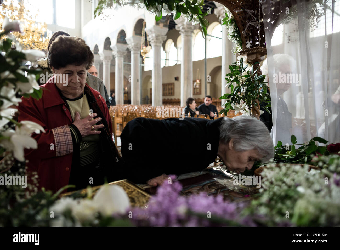 Thessaloniki, Greece. 18th April 2014. A worshiper kisses a bible ...
