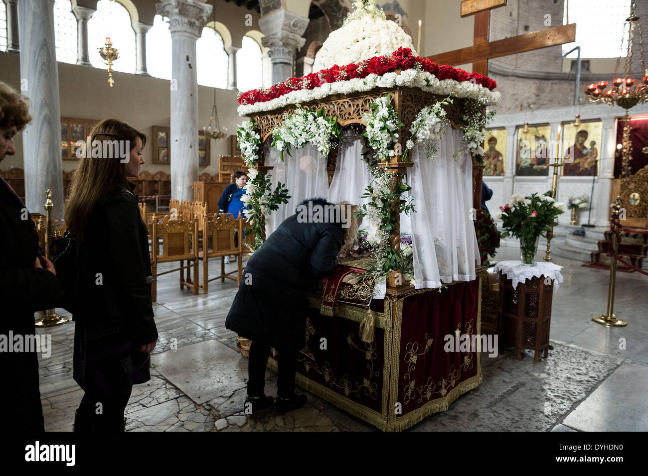 Thessaloniki, Greece. 18th April 2014. A worshiper kisses a bible ...