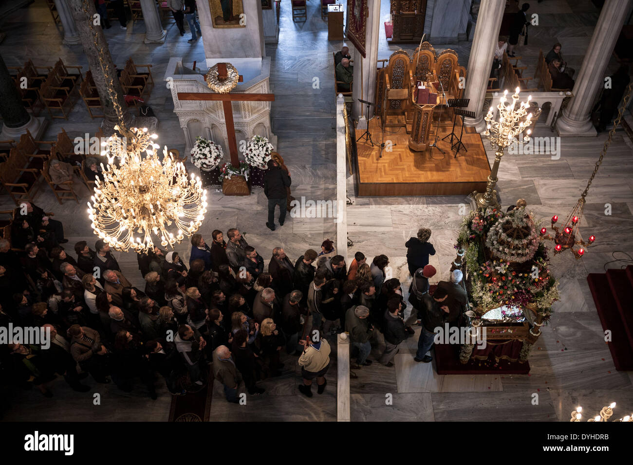 Thessaloniki, Greece. 18th April 2014. A worshiper touches a bible ...