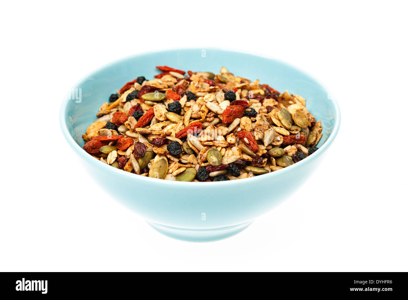 Bowl of homemade granola with various seeds and berries isolated on ...