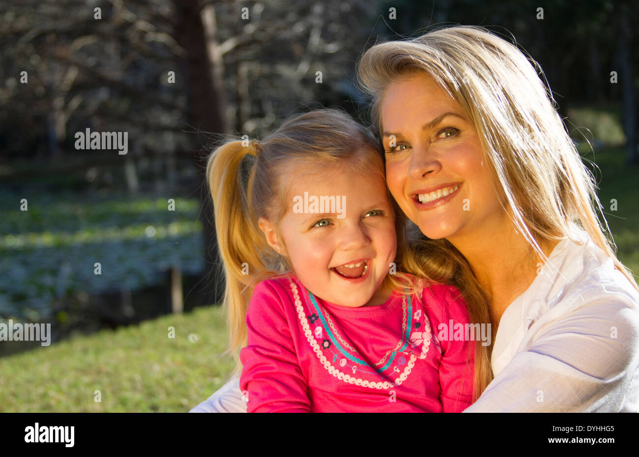 mother and daughter hugging and cuddling at the park Stock Photo - Alamy